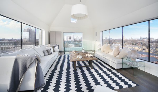 Living room in converted water tower tank with 360° views over London ...